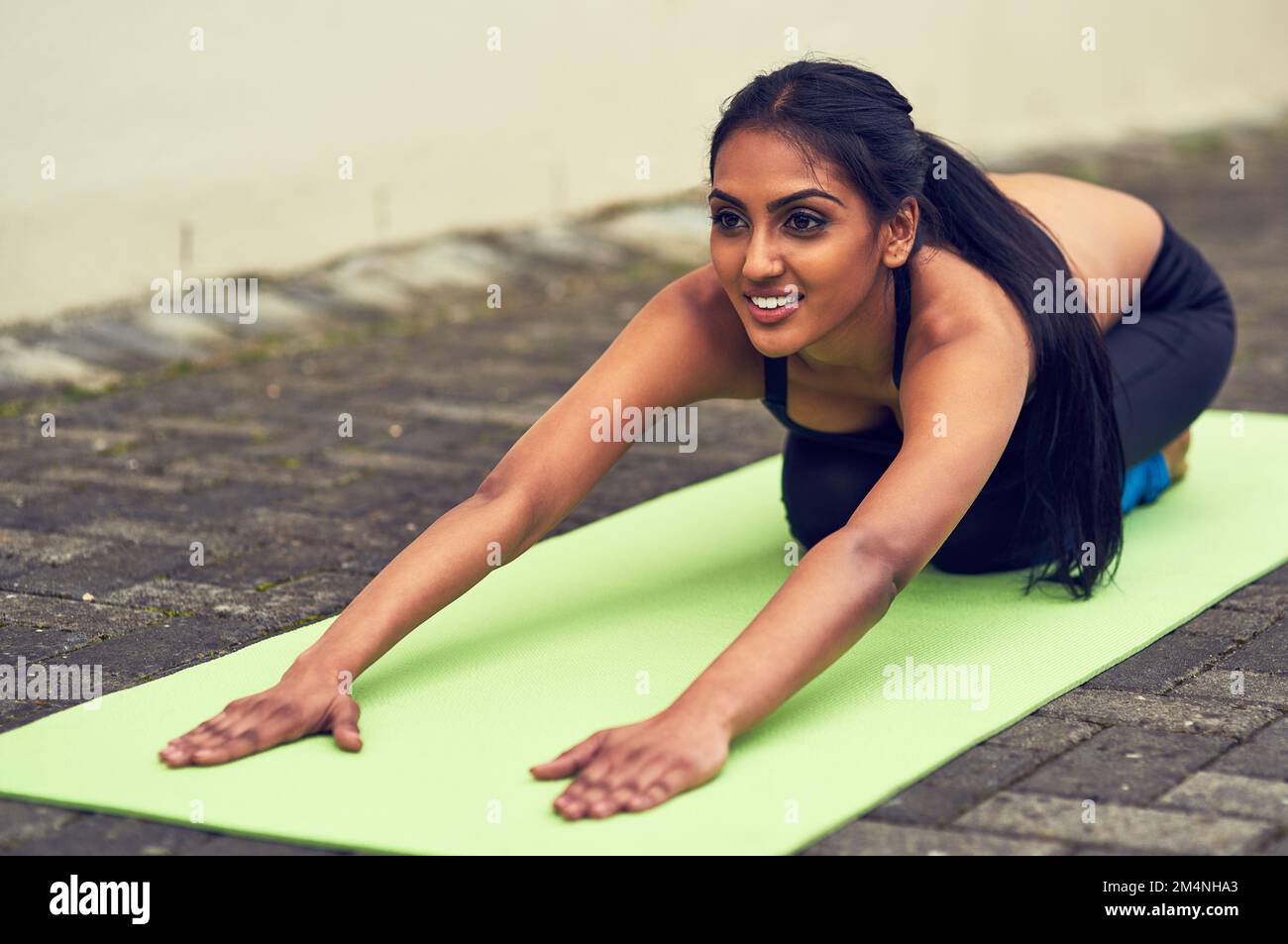 Bending and stretching can do a lot for your body. a beautiful young ...