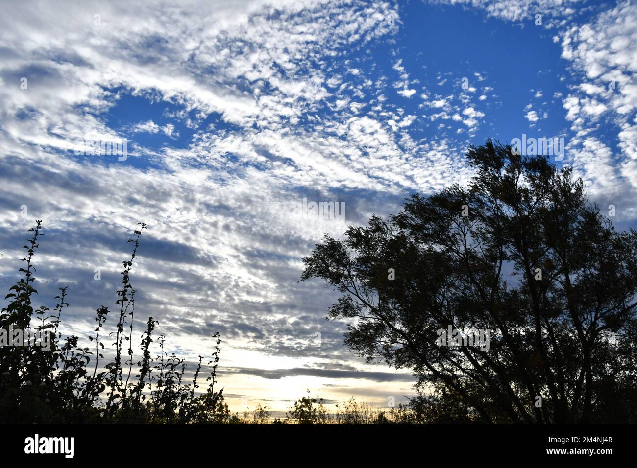 the clouds play and form patterns in the sky Stock Photo - Alamy