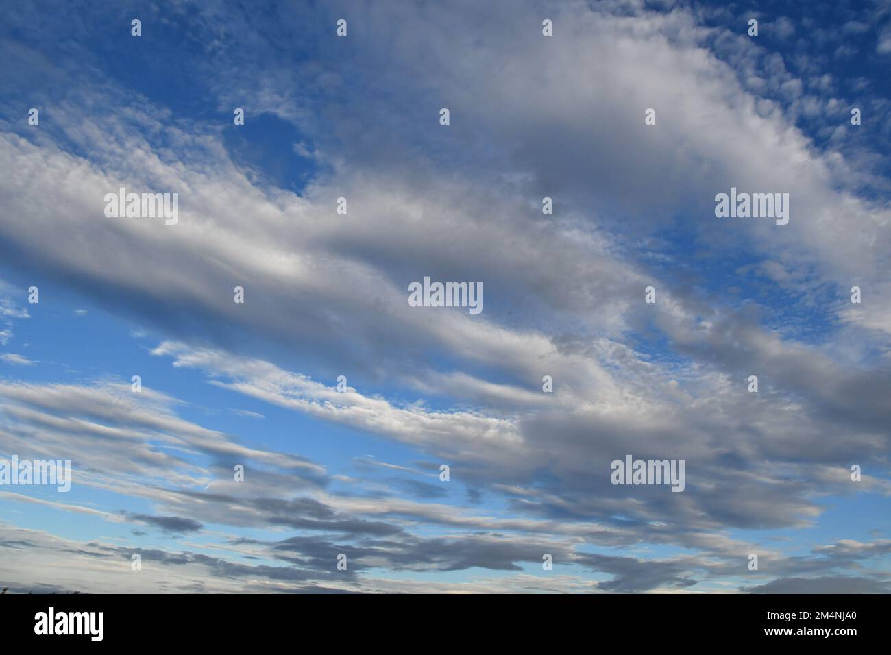 the clouds play and form patterns in the sky Stock Photo - Alamy