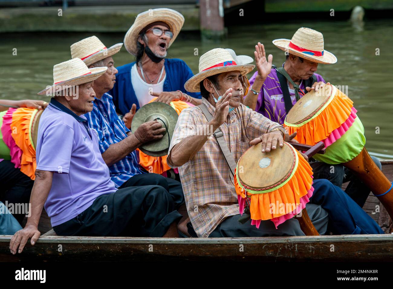 Traditional People on a woodboat at the Floating Market at the Klong ...