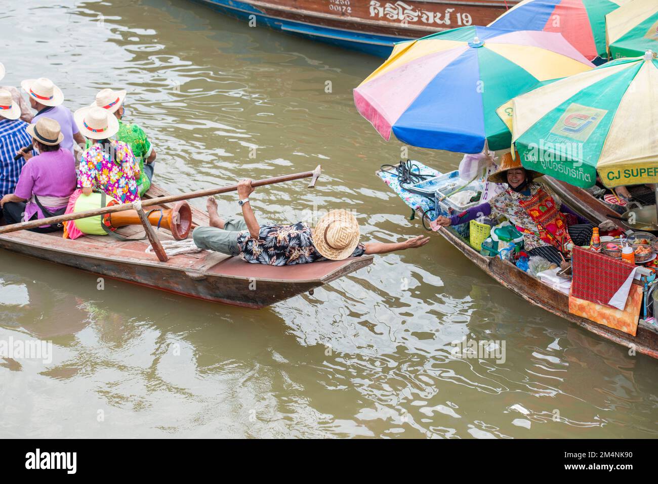 Traditional People on a woodboat at the Floating Market at the Klong ...