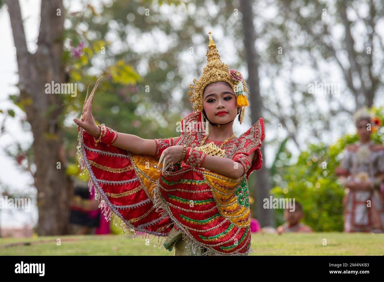Young traditional Thai Dancer at a show on the Loy Krathong Festival in the Town of Amphawa in ...