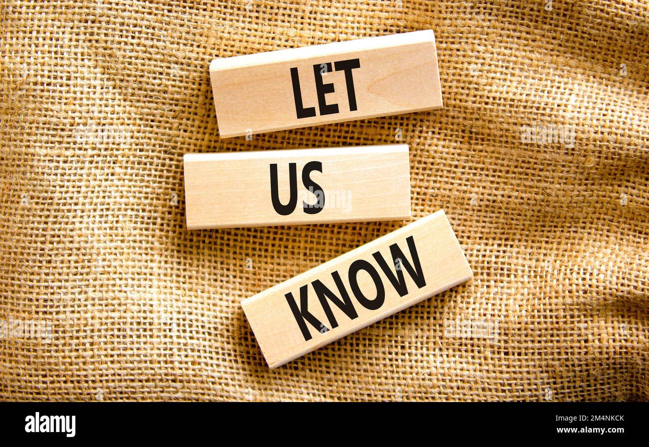 Let us know symbol. Concept words Let us know on wooden blocks on a ...