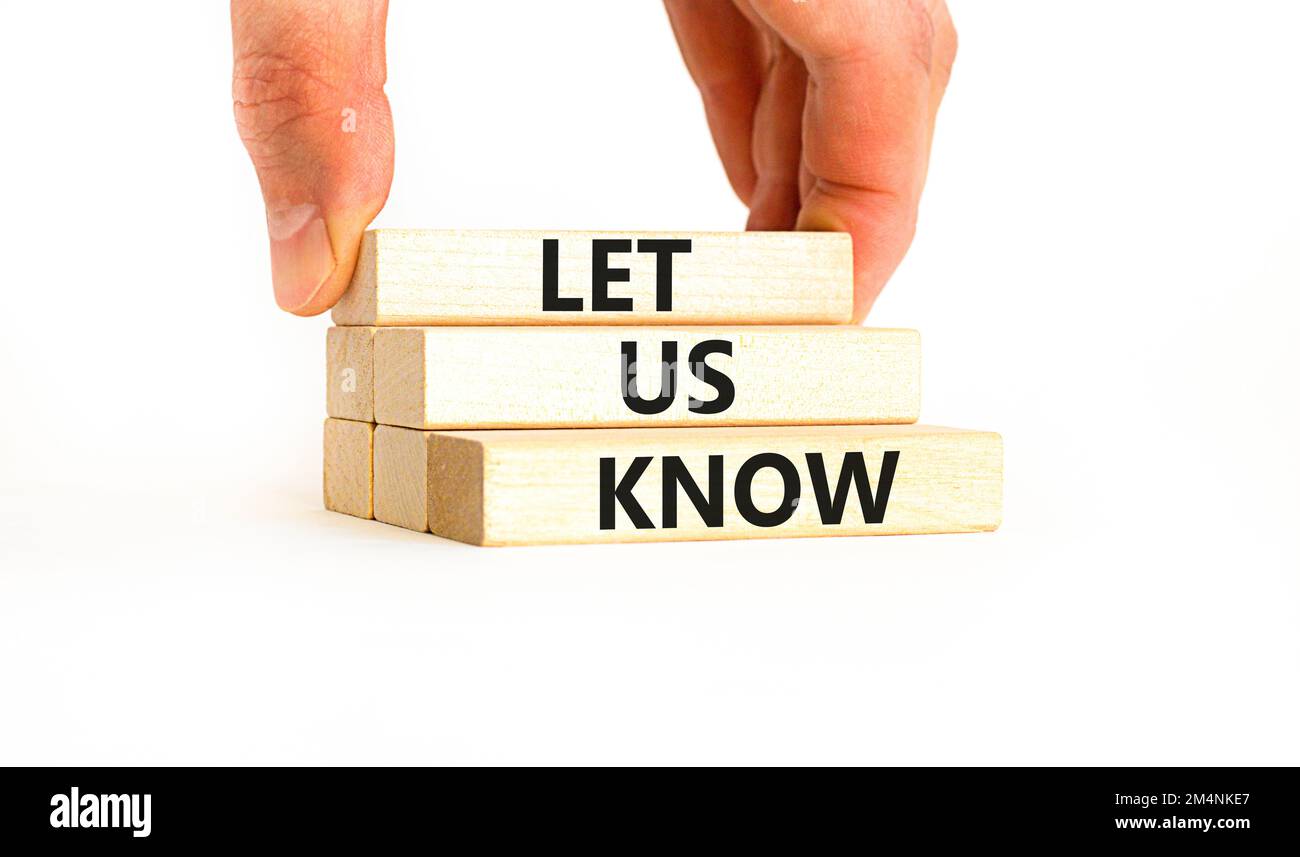 Let us know symbol. Concept words Let us know on wooden blocks on a beautiful white table white ...