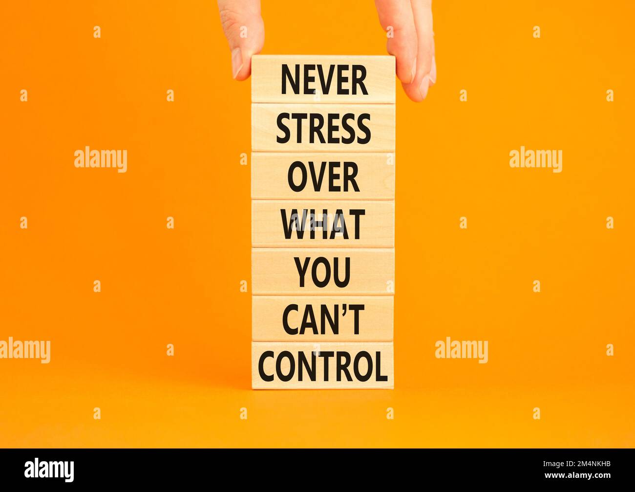 Never stress symbol. Wooden blocks with words Never stress what you can ...