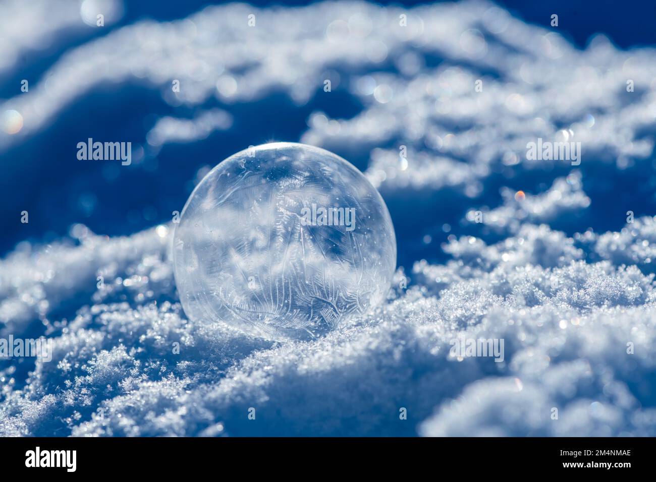 frozen soap bubble in the snow Stock Photo - Alamy
