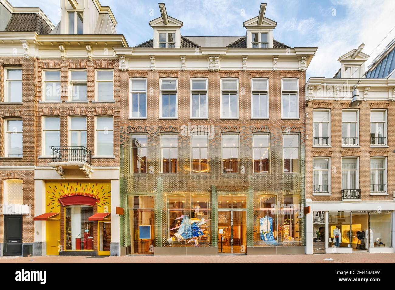 the outside of a building with people walking in front and on the ...