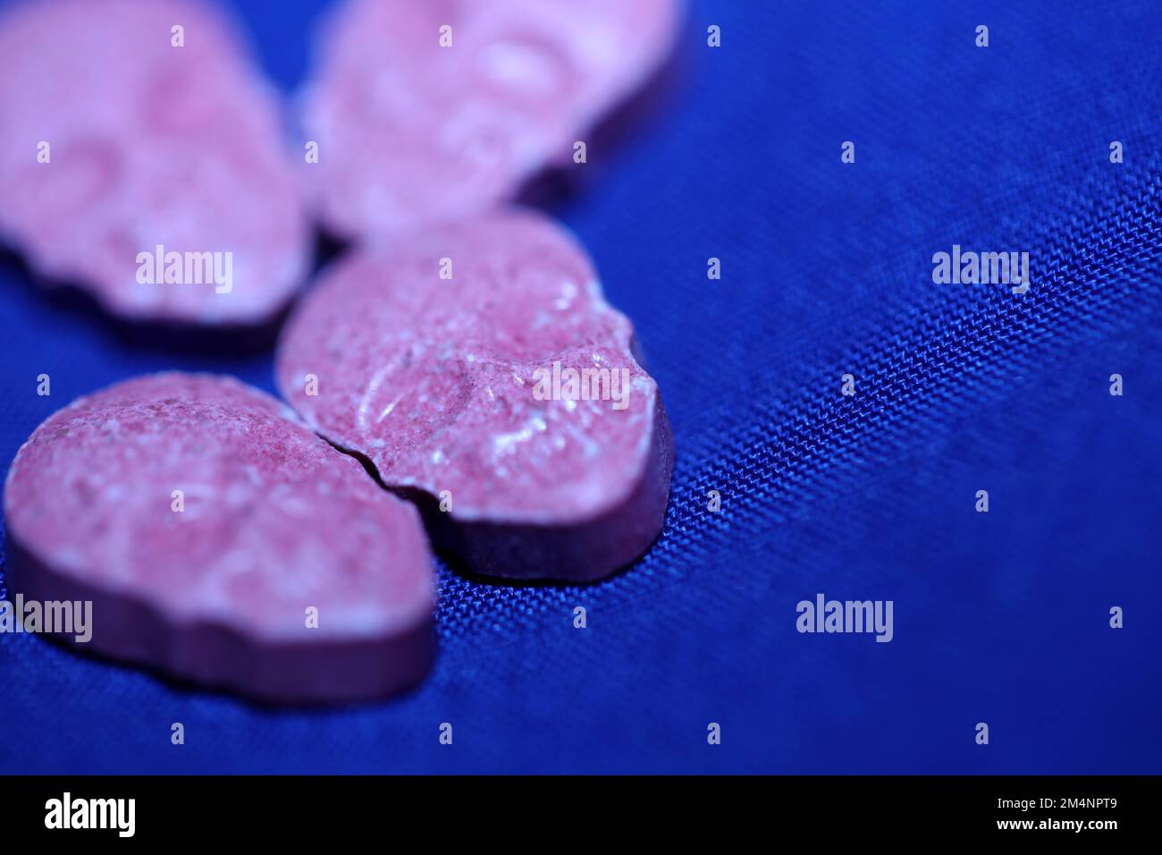 Pink skull ecstasy pill close up background high quality prints purple ...