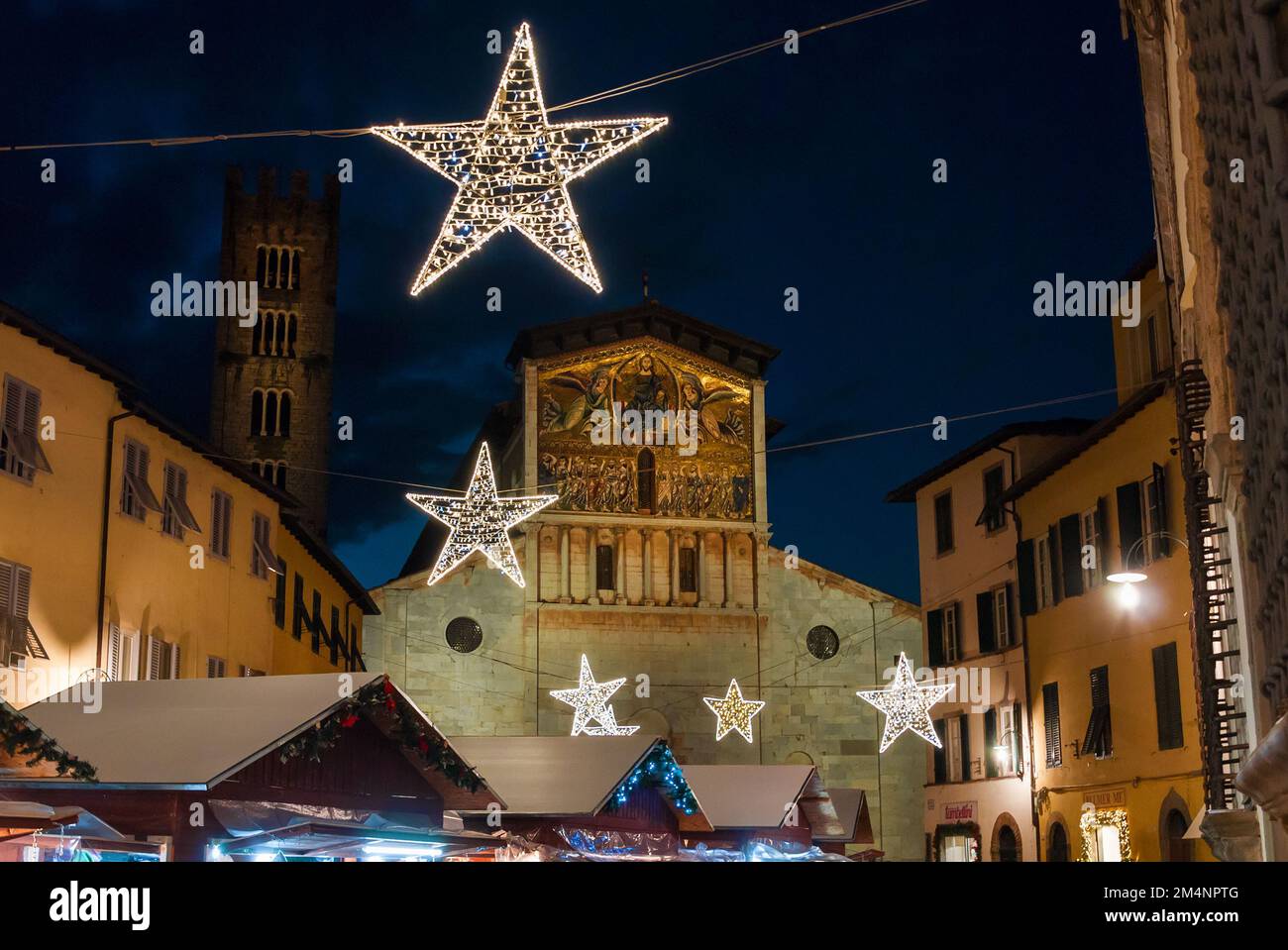 Christmas in Lucca. Christmas market with stars in front of St Frediano ...