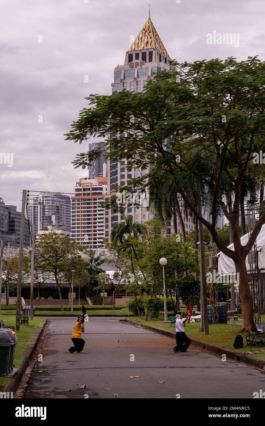 Bangkok, Thailand. November 14, 2022. Two people practicing tai chi fan ...