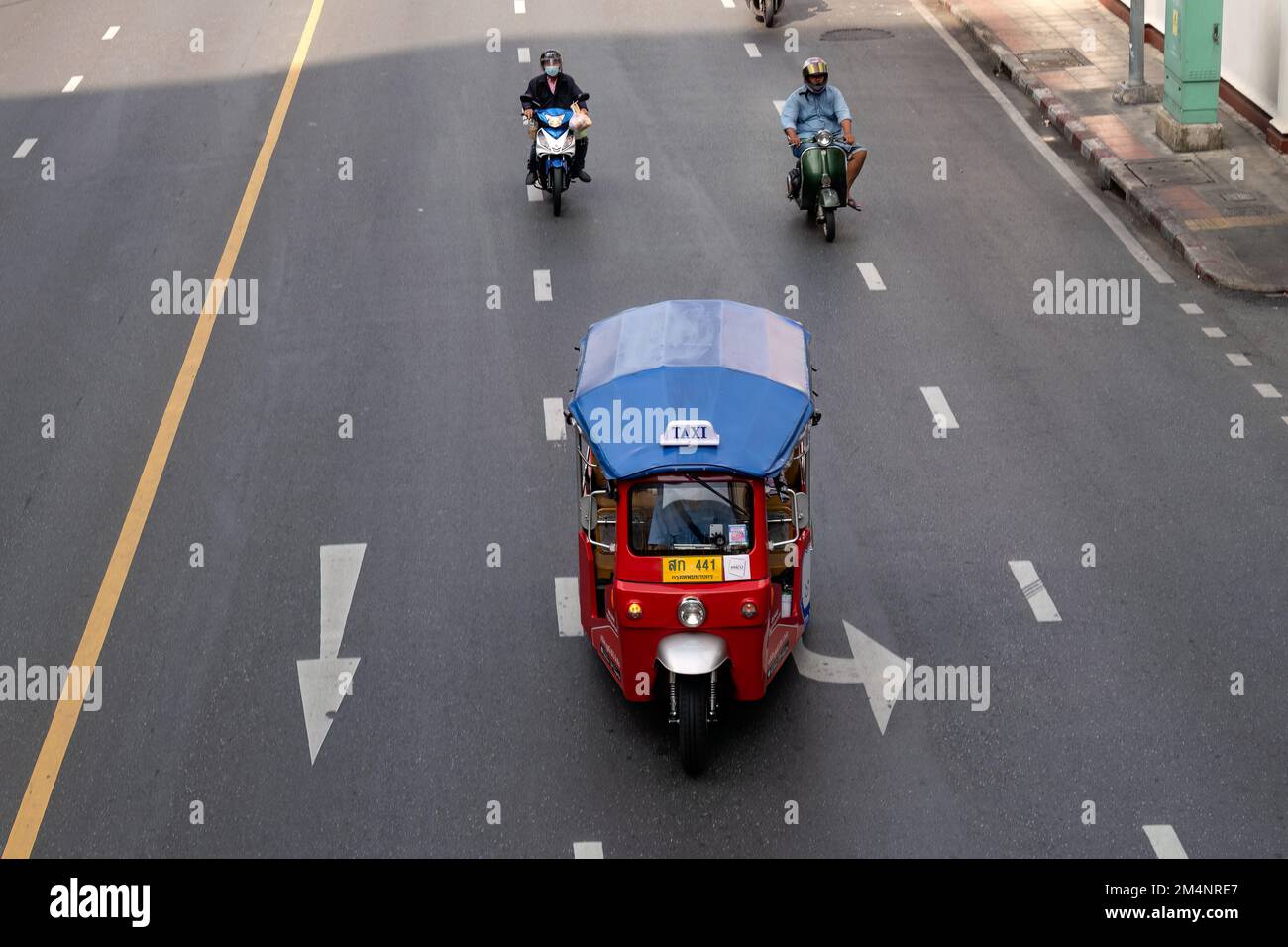 Bangkok, Thailand. November 16, 2022. Red tuk tuk taxi on a road in ...