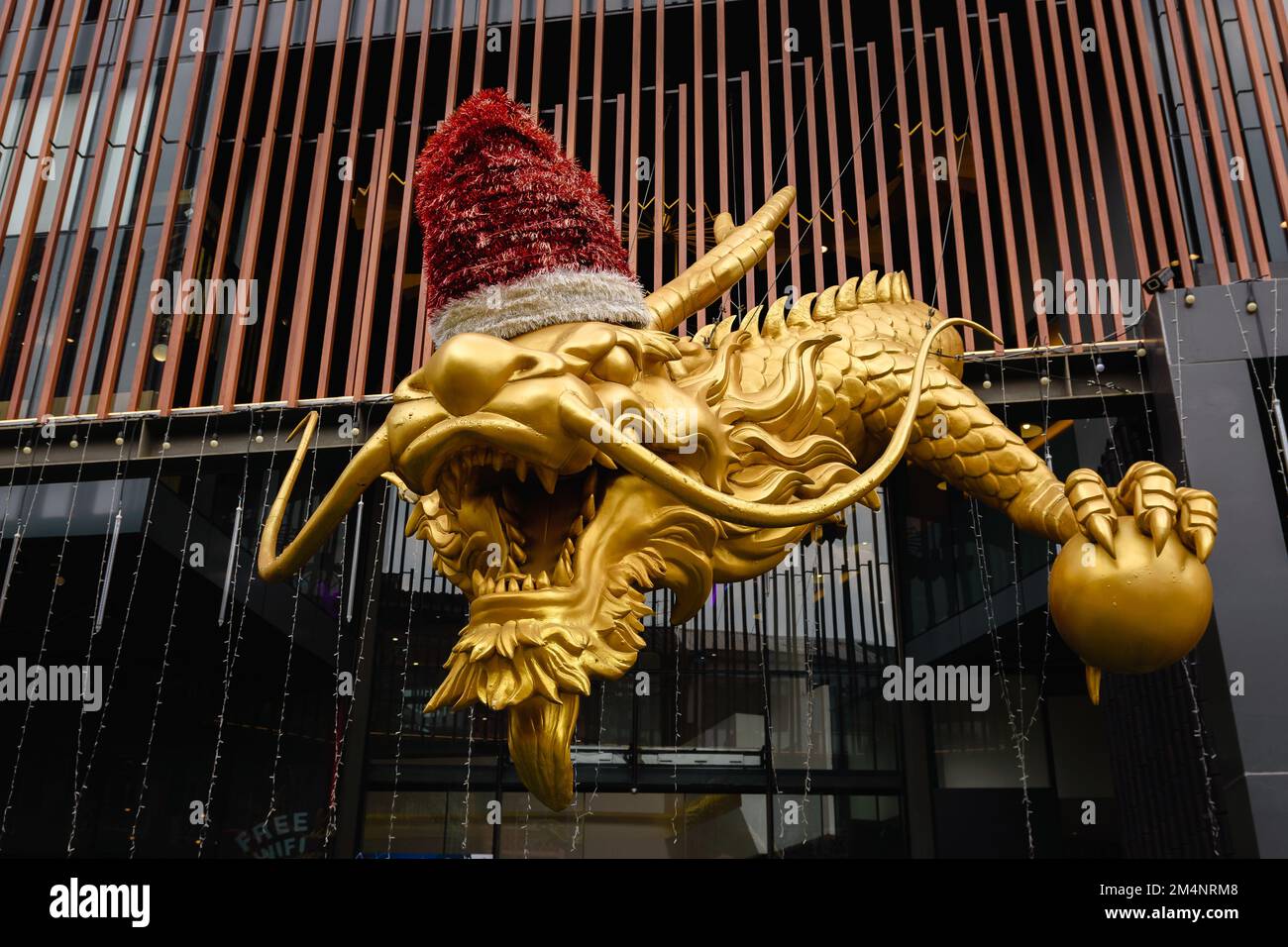 Bangkok, Thailand. November 16, 2022. Yellow dragon at the entrance of ...