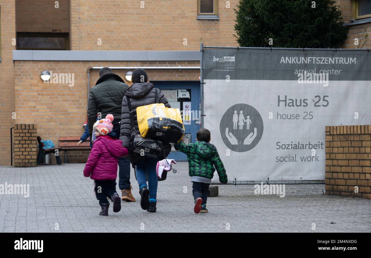 Berlin, Germany. 22nd Dec, 2022. A refugee walks with his family on the ...