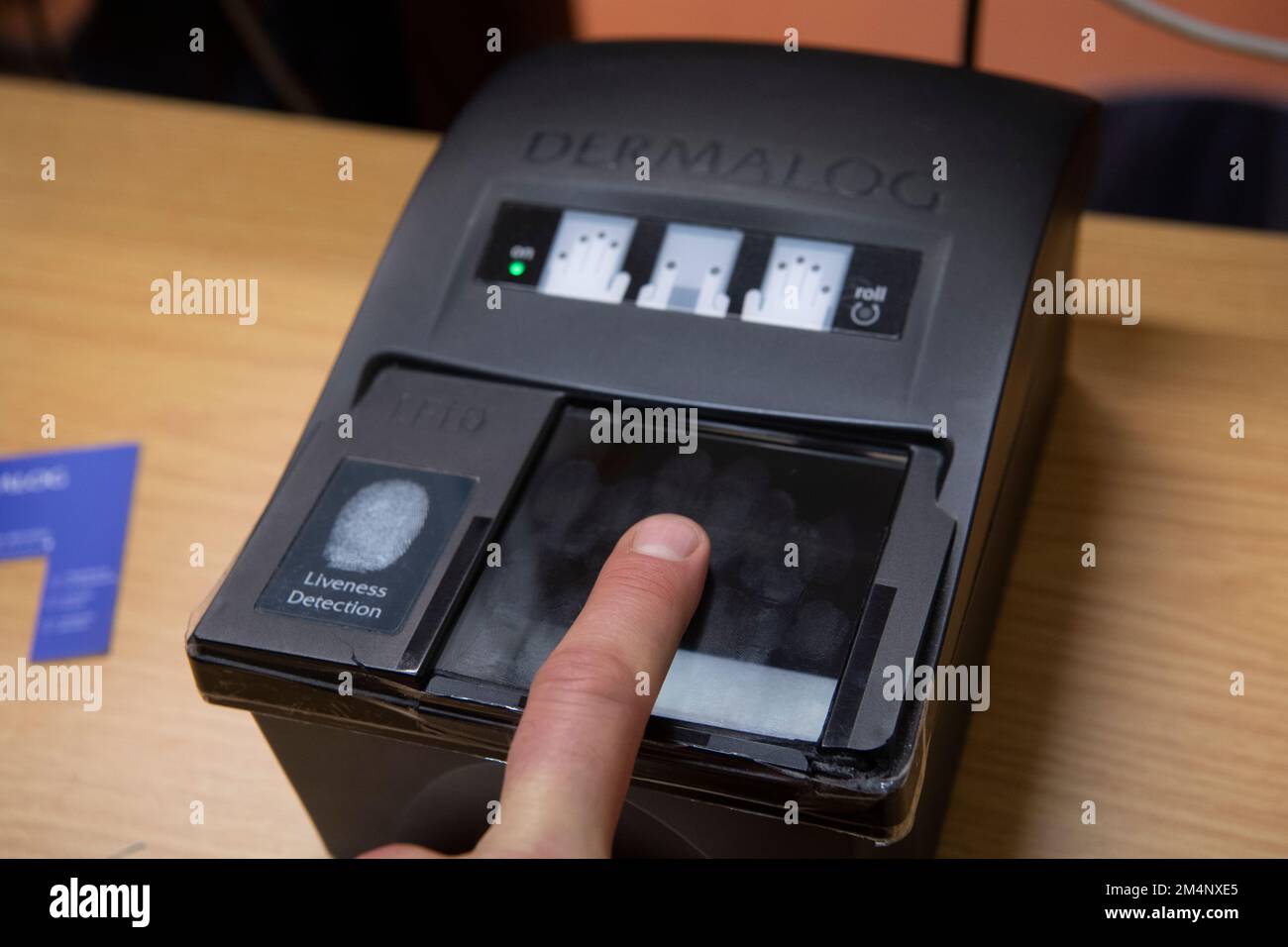 Berlin, Germany. 22nd Dec, 2022. A fingerprint is taken from a man in ...