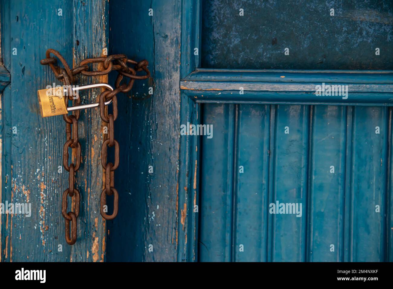 Typical white and blue painted frames of doors and windows with rusty ...
