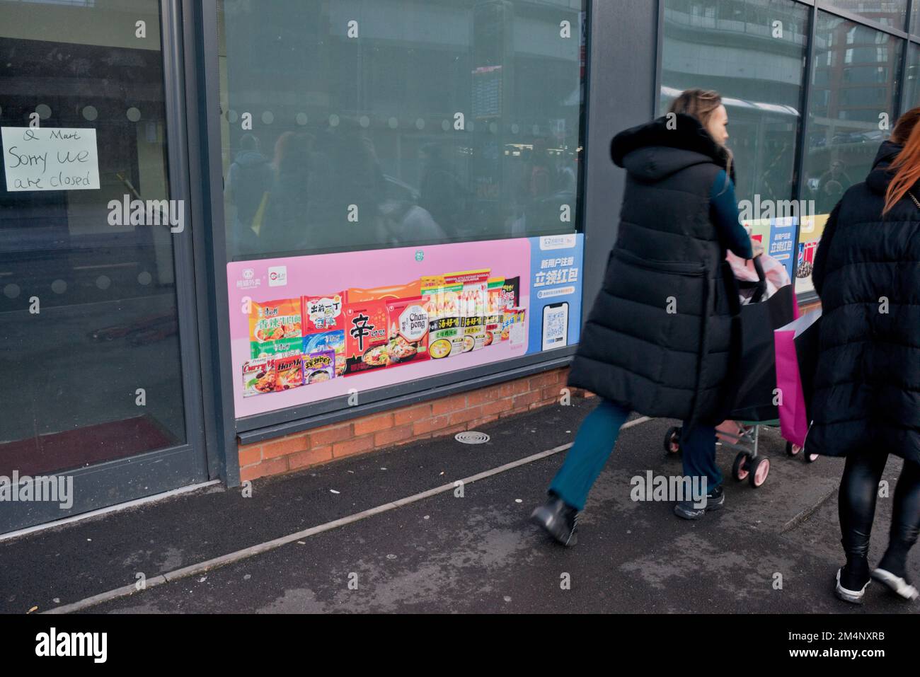People walking past empty closed down shops in Chinatown in Birmingham ...
