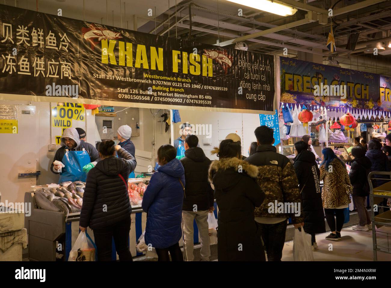 People buying meat and fish at the Bull Ring indoor markets in ...