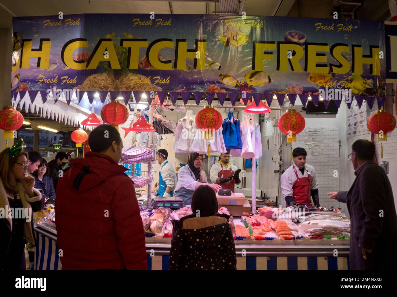 People buying meat and fish at the Bull Ring indoor markets in ...
