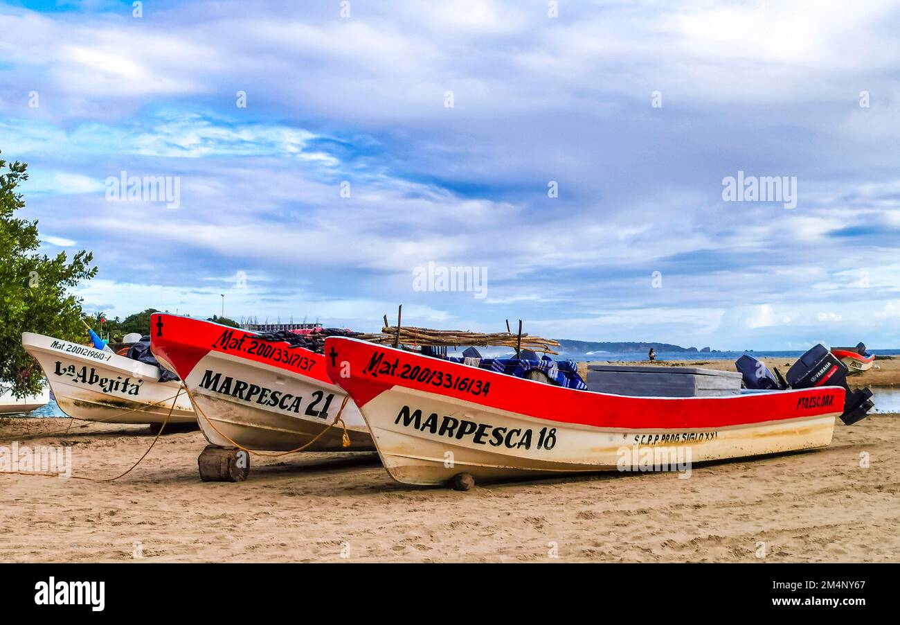 Fishing boats at the harbor and beach by Zicatela in Puerto Escondido ...