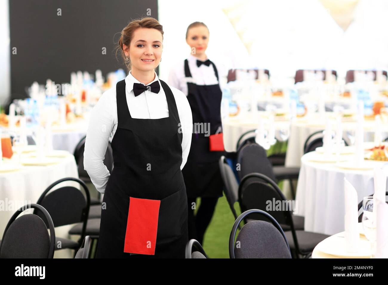 Large group of waiters and waitresses standing in row Stock Photo - Alamy