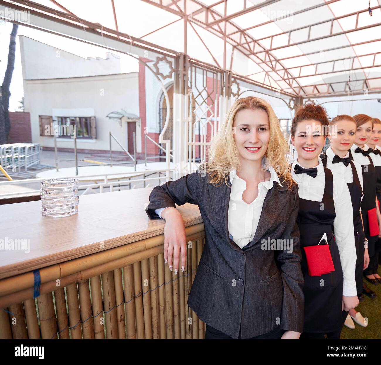 hotel staff standing in the corridor of a modern hotel Stock Photo - Alamy