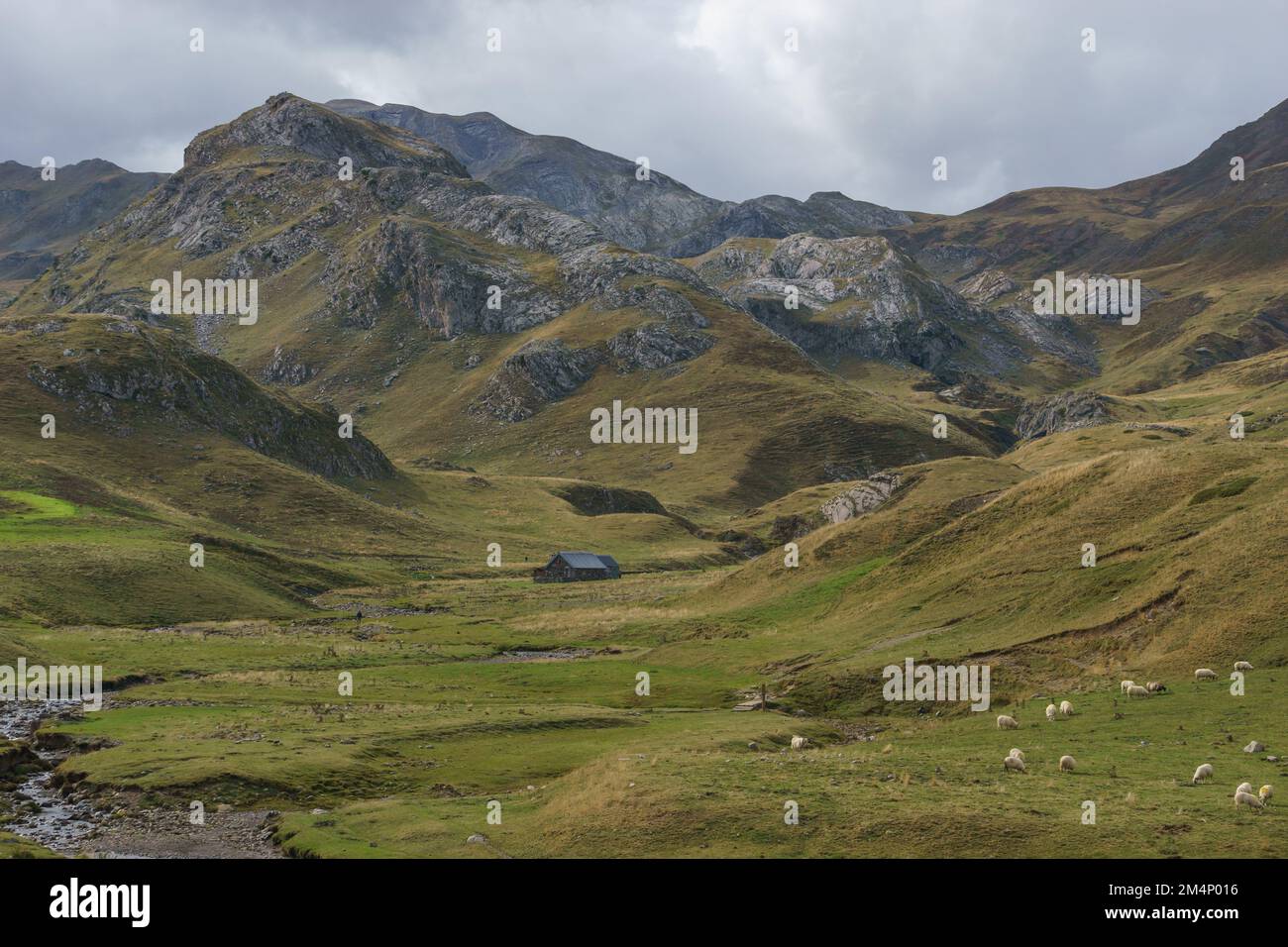 Landscape of Pyrenees Mountains with remote farm house building at the ...