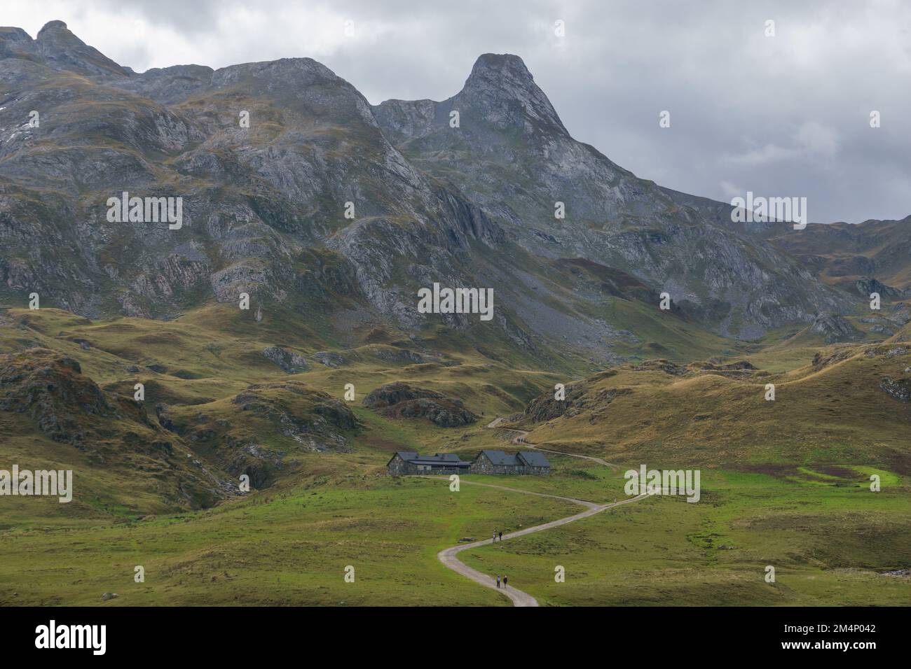 Landscape of Pyrenees Mountains with remote farm house building at the ...