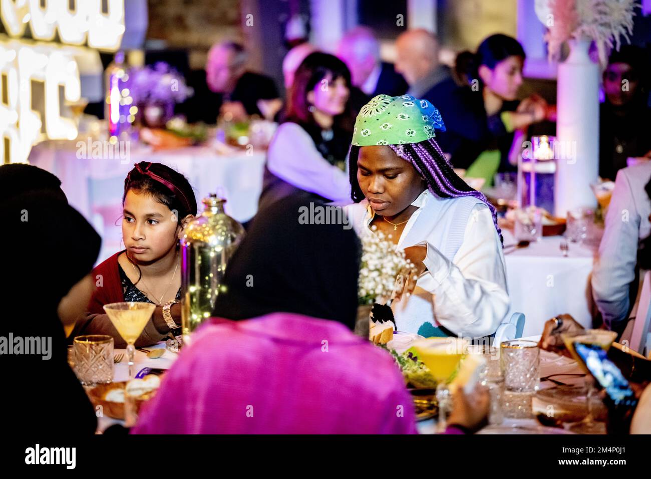 THE HAGUE - Visitors during a dinner for refugee youths. NPO FunX ...