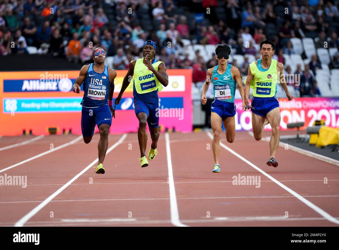 David Brown and Dongdong Di competing in the 200m T11 visually impaired ...