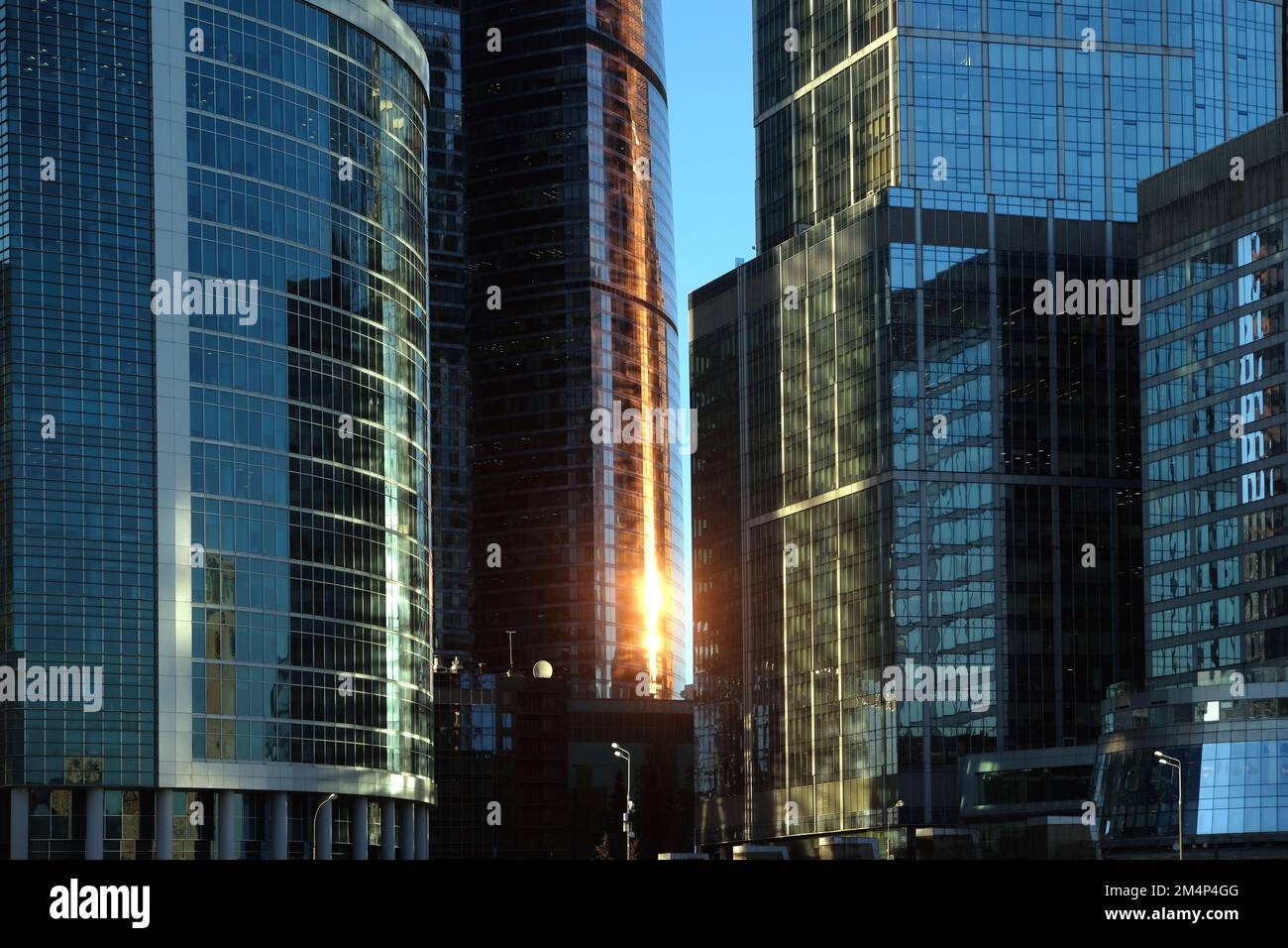 Dense standing building skyscrapers in business area with sun ...