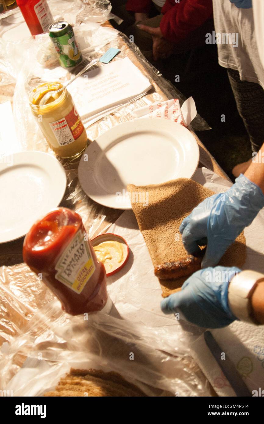 A person prepares a crepe/Eyepix Group (Credit Image: © Martin Bertrand ...