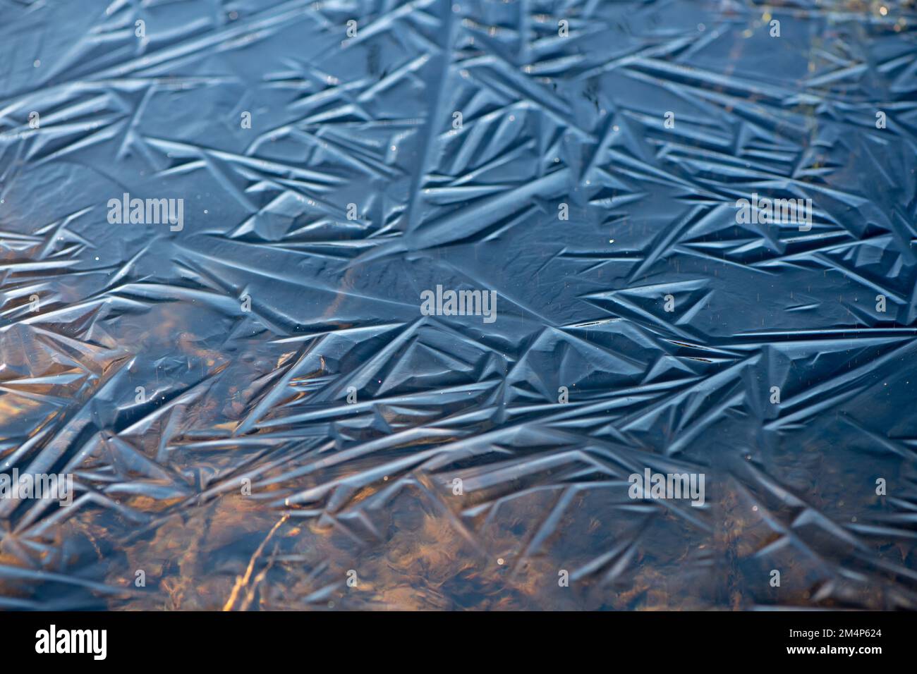 Ice patterns form on a New Forest Stream shown by catching the winter ...