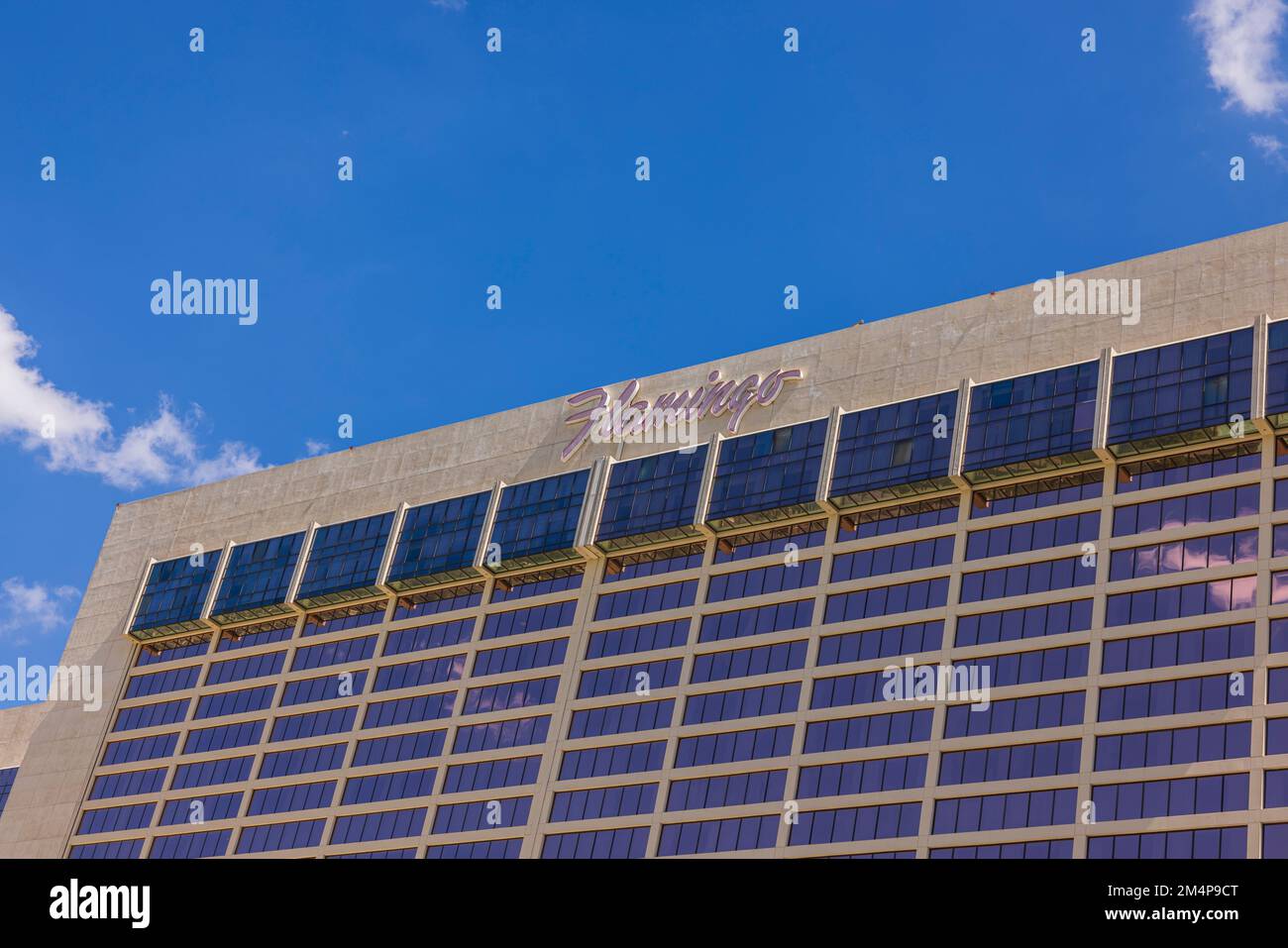 View of Flamingo logo on top of hotel building on blue sky background ...