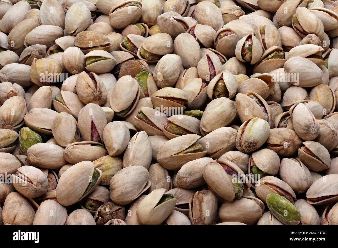 Pistachios nuts background Stock Photo - Alamy
