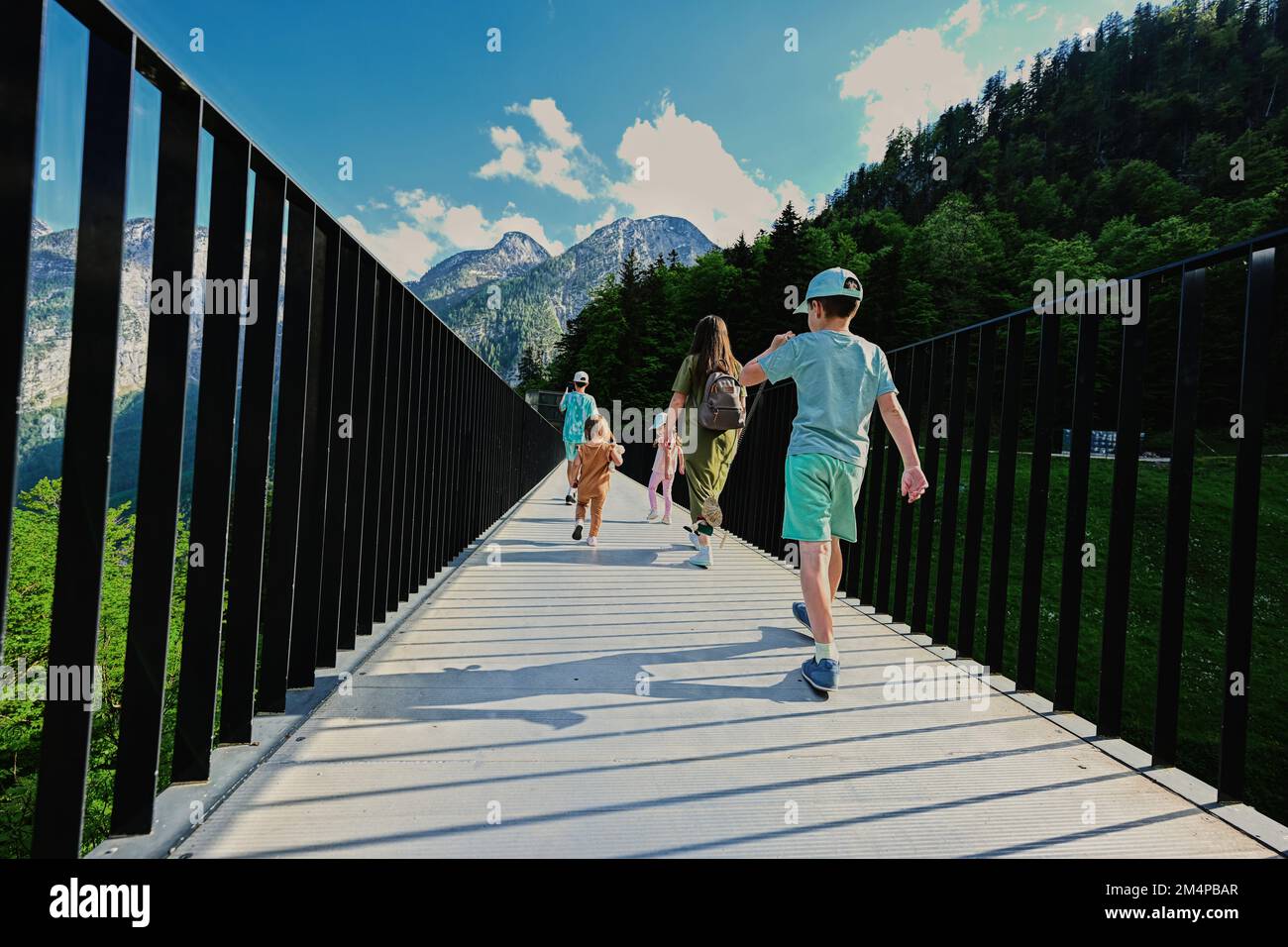 Mother with children at observation bridge in Hallstatt, Austria Stock ...