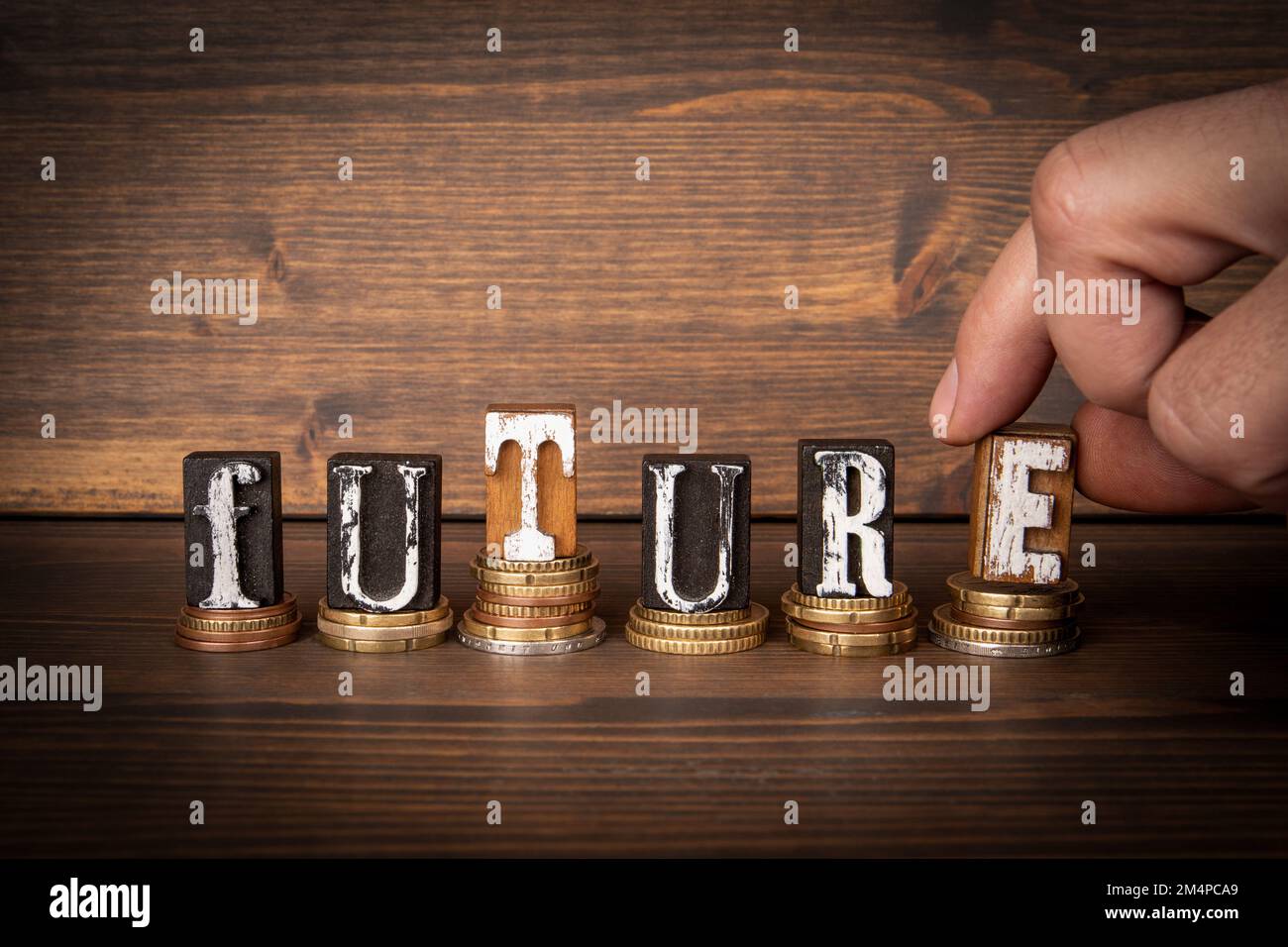 Future concept. Alphabet letters and change on wood texture background ...