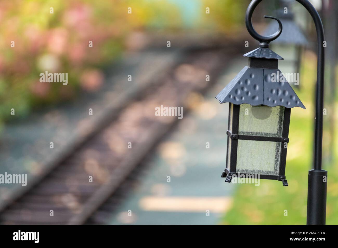 Lamp lantern in entertainment railway attraction. Railway in summer ...