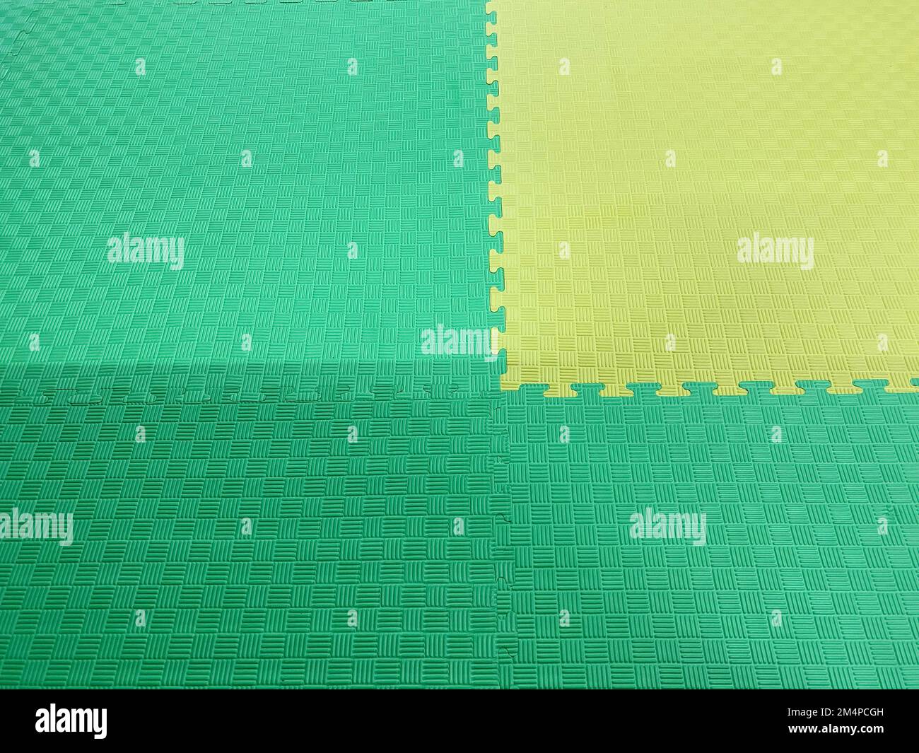 Green and yellow rubber mat for sports and children's playground Stock ...
