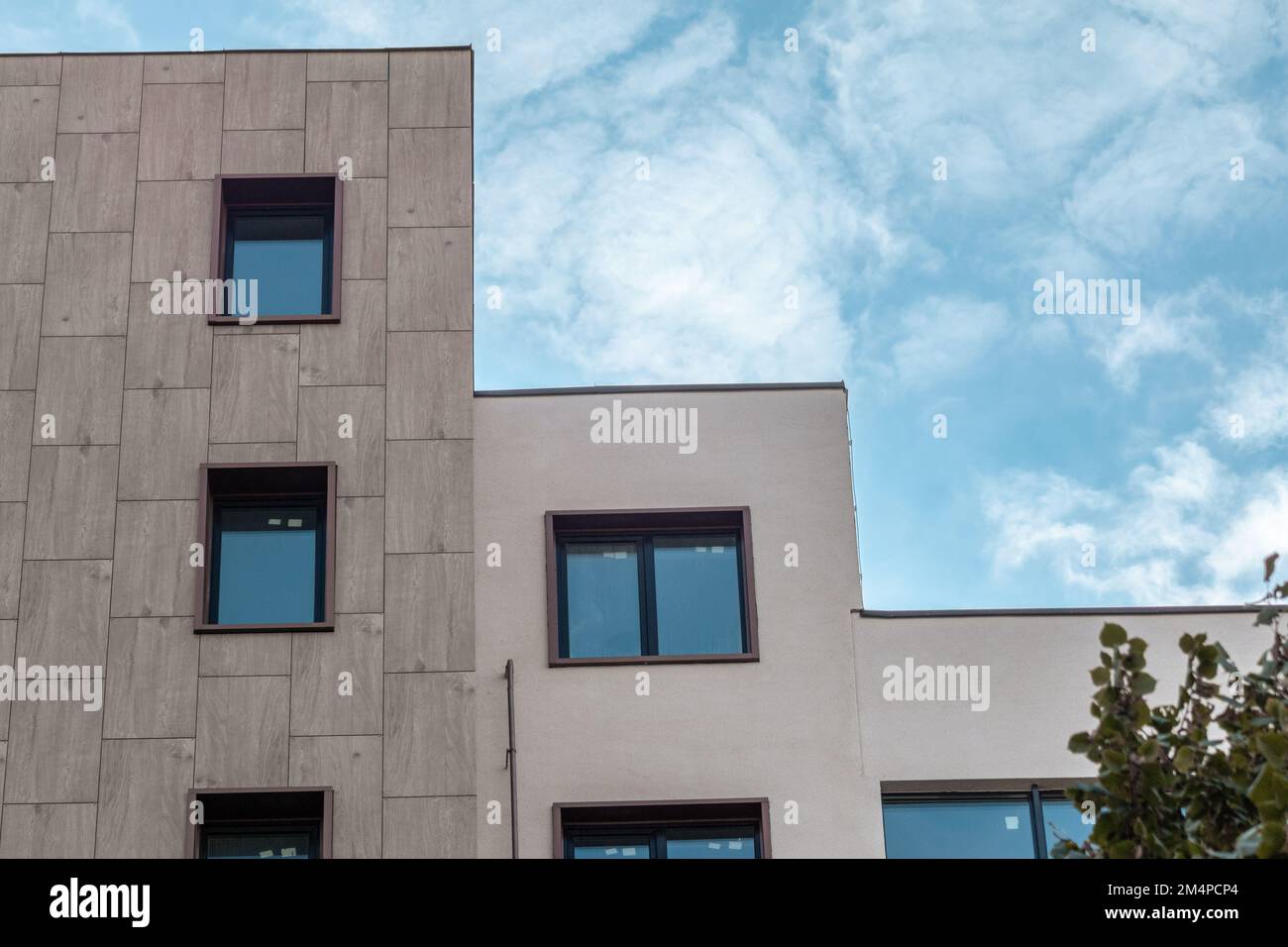 Modern residential building facade architecture details. Tiled and ...