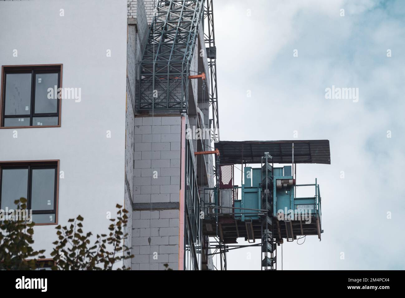 Multistory white brick building construction site details, outdoor ...