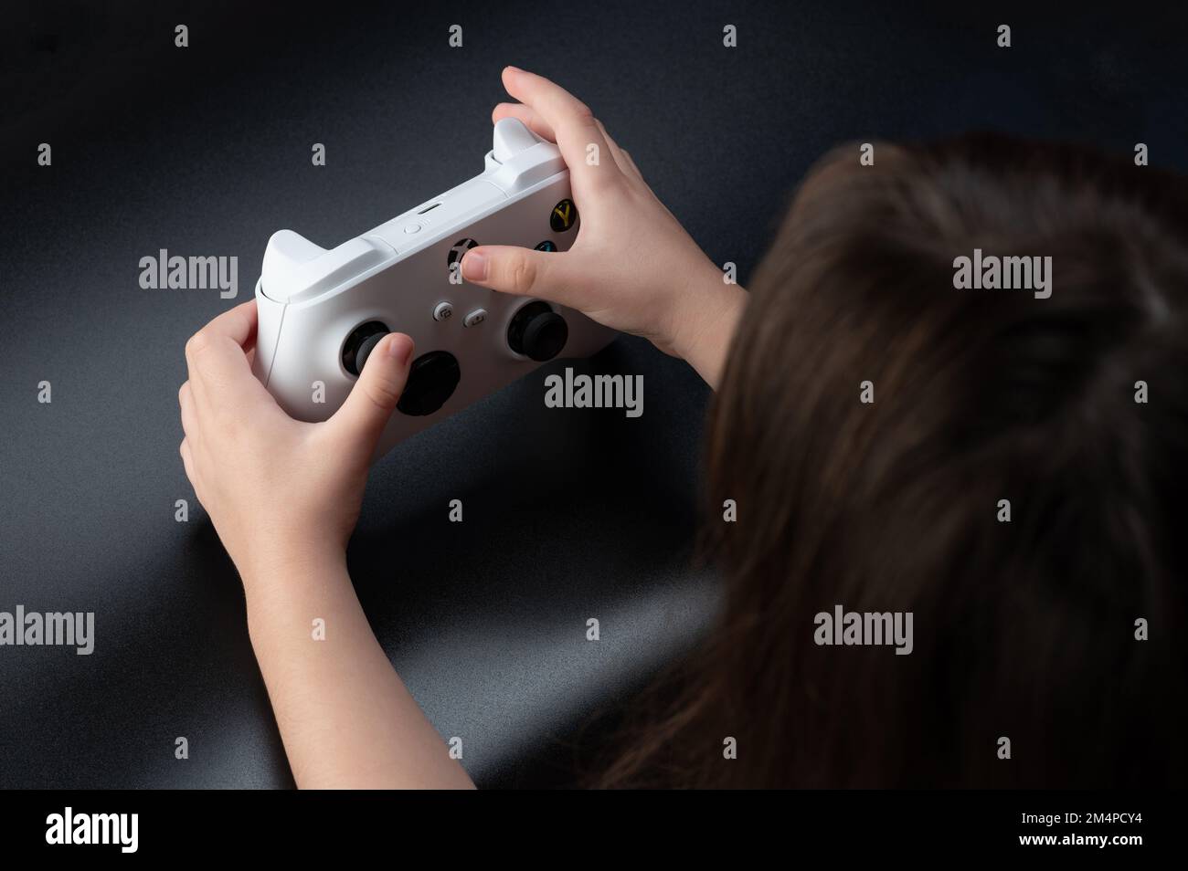 New york, USA - December 21, 2022: Kid start xbox x game console back ...