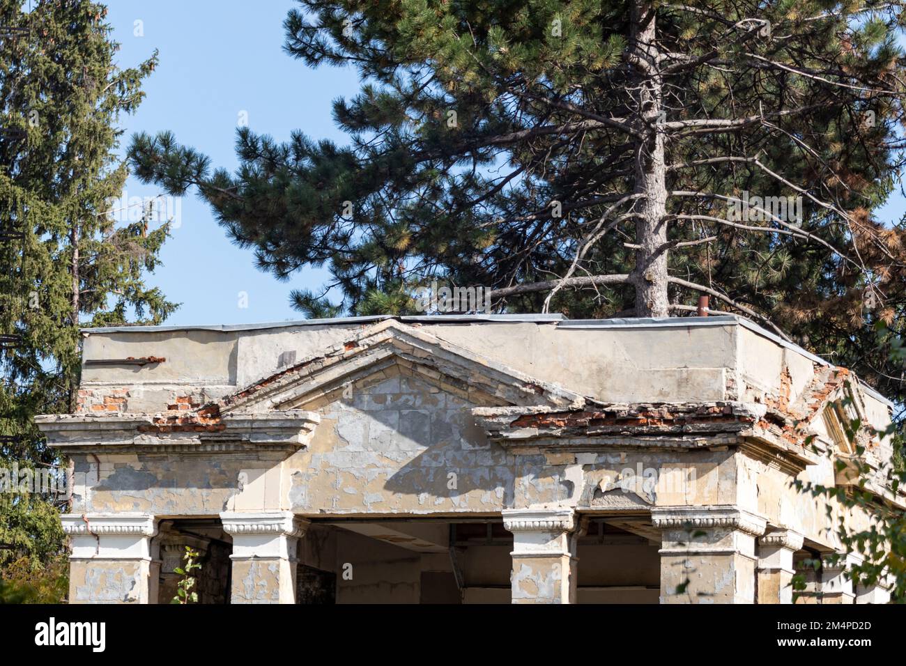 Stalinist architecture entrance facade of weathered old Soviet building ...