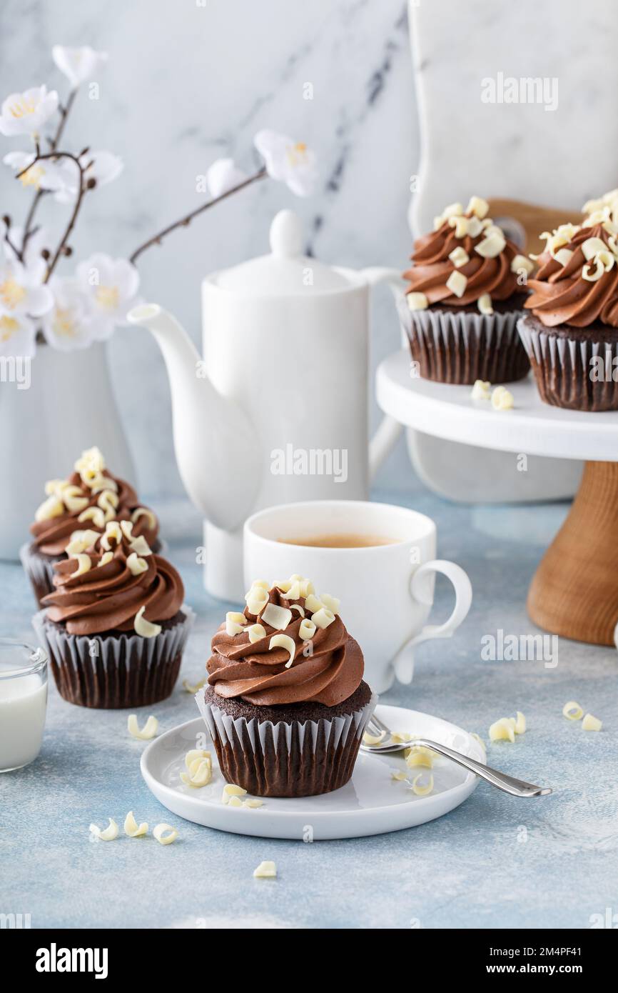 Chocolate cupcakes with sweet chocolate ganashe frosting Stock Photo ...