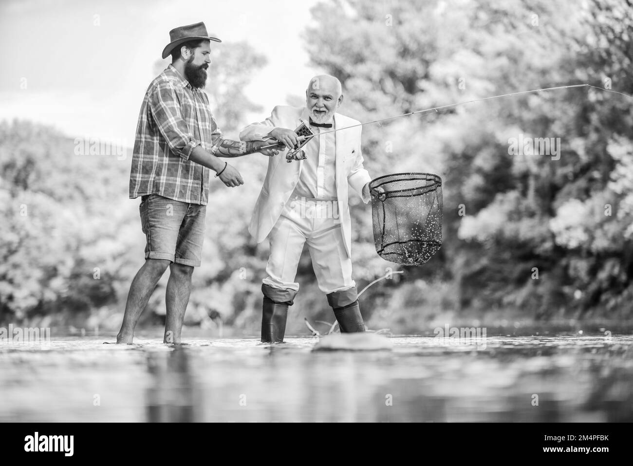 two fishermen. successful catch. granddad and drandson fishing. retired ...