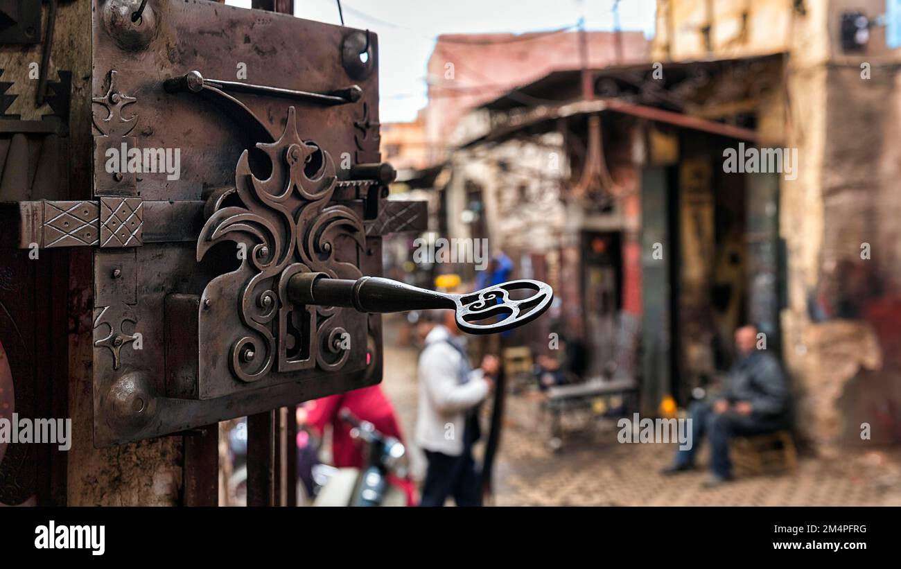 Key is in the lock, handmade, traditional oriental wrought iron with ...