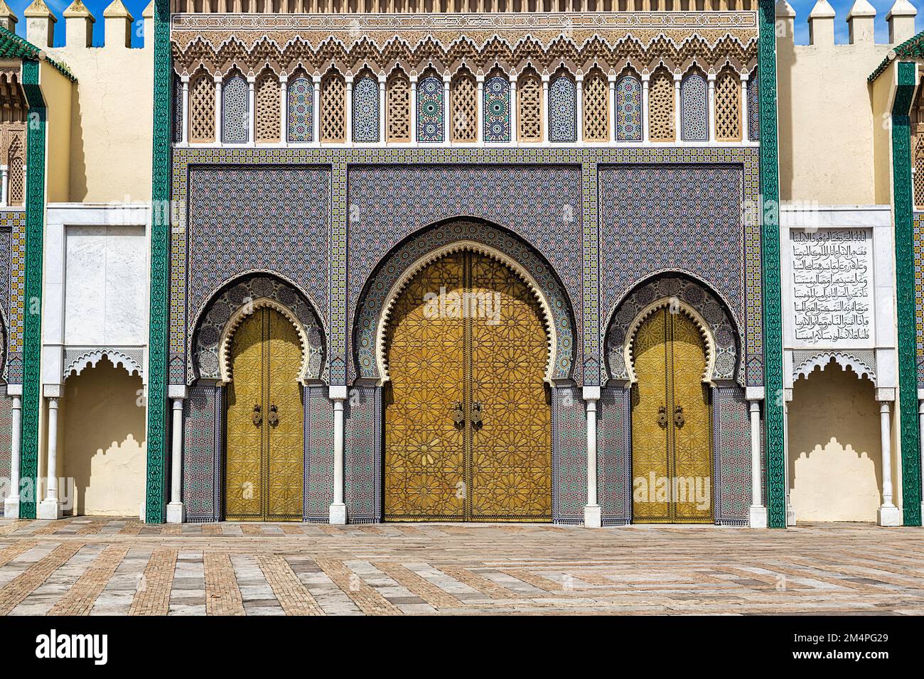 Entrance gate to the royal palace Dar el Makhzen, brass doors, marble ...