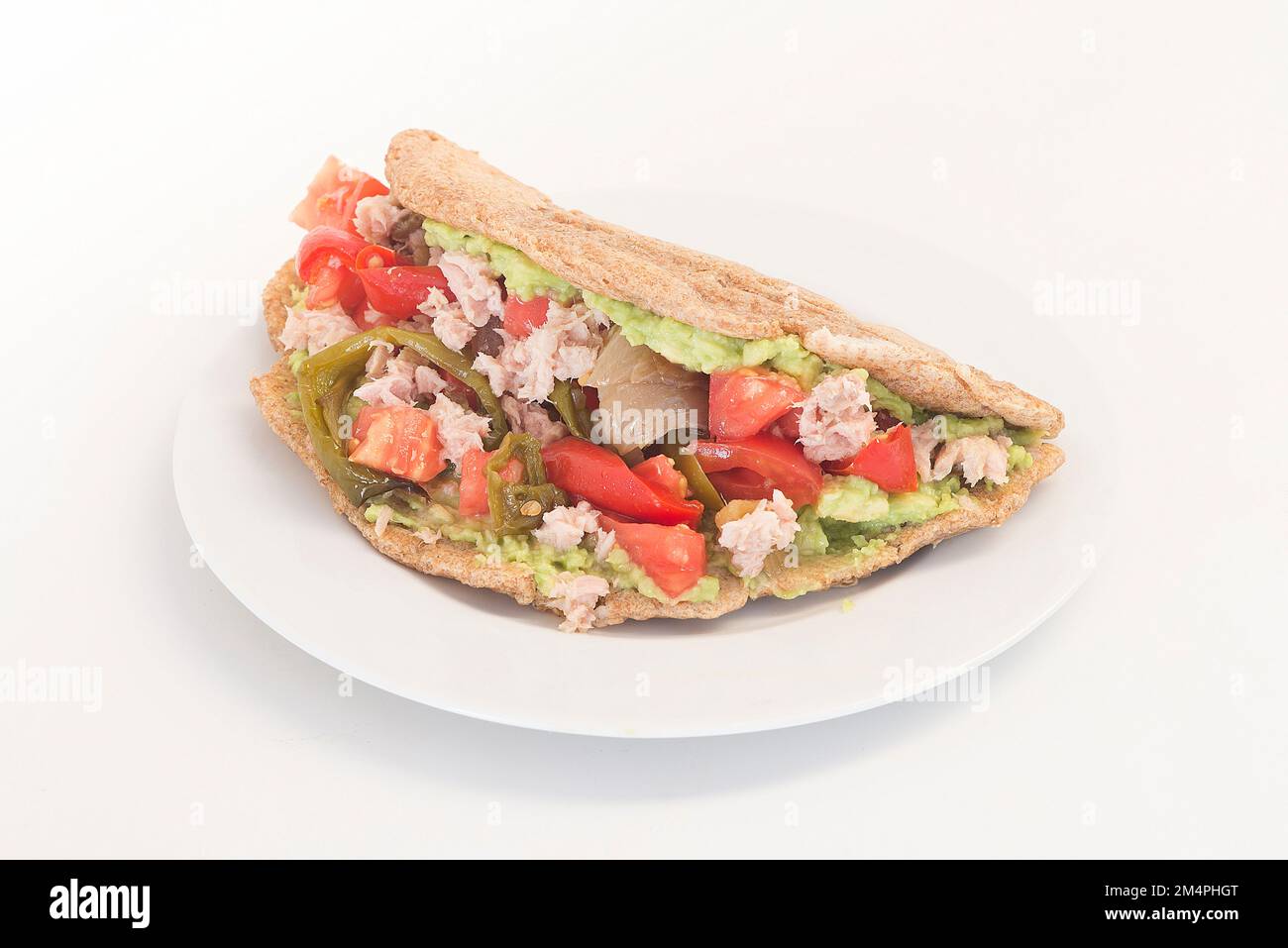 Mexican food- integral fajita with tuna, pepper, tomato and avocado ...