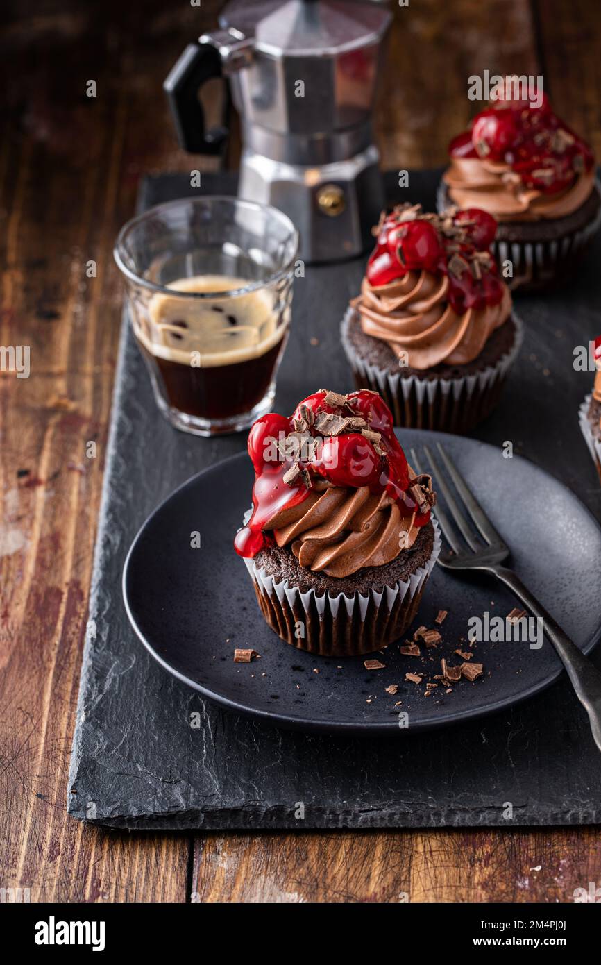 Chocolate cupcakes with dark chocolate ganashe frosting Stock Photo - Alamy