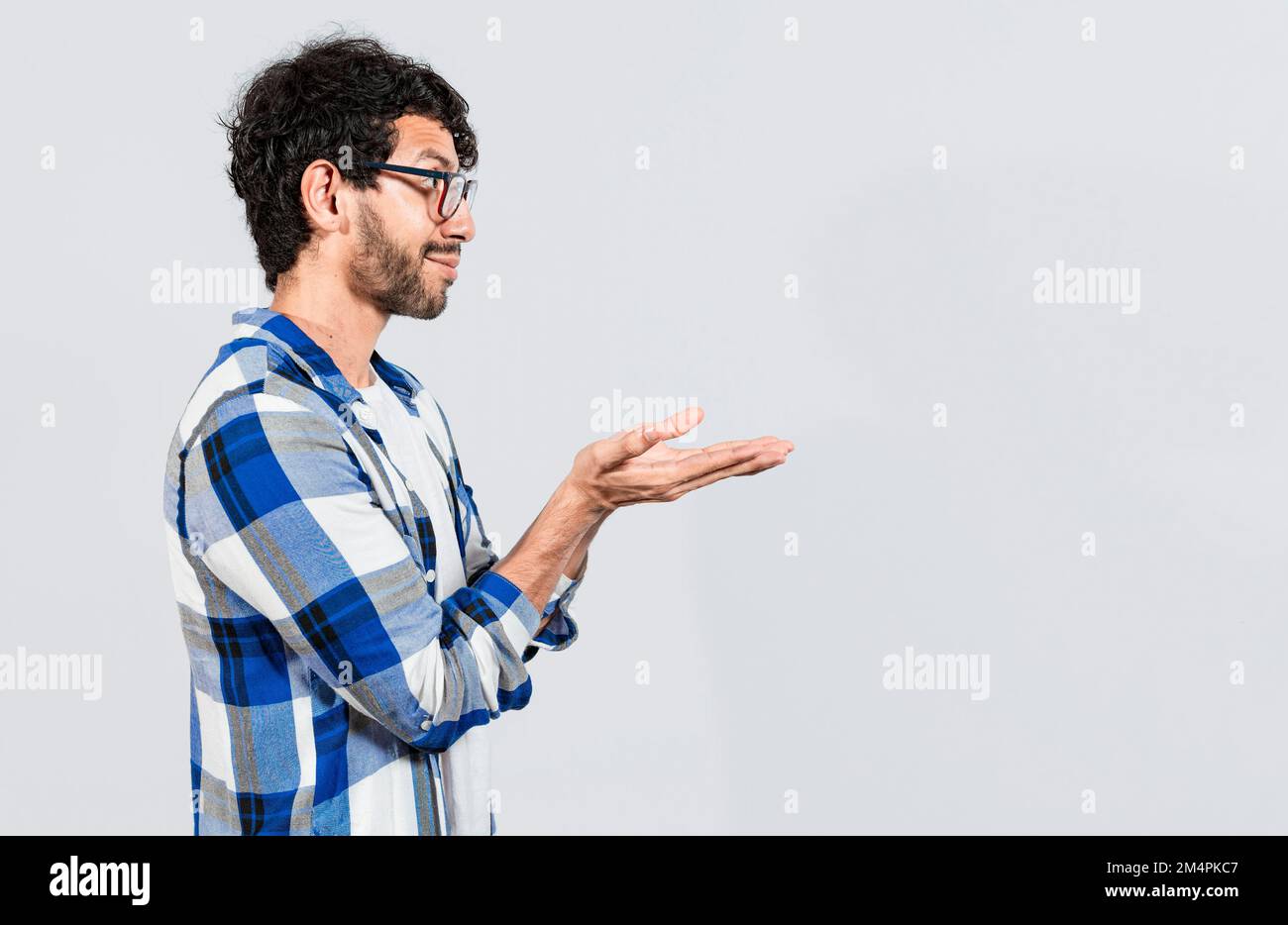 Smiling person recommending a product with his hands, Man recommending ...