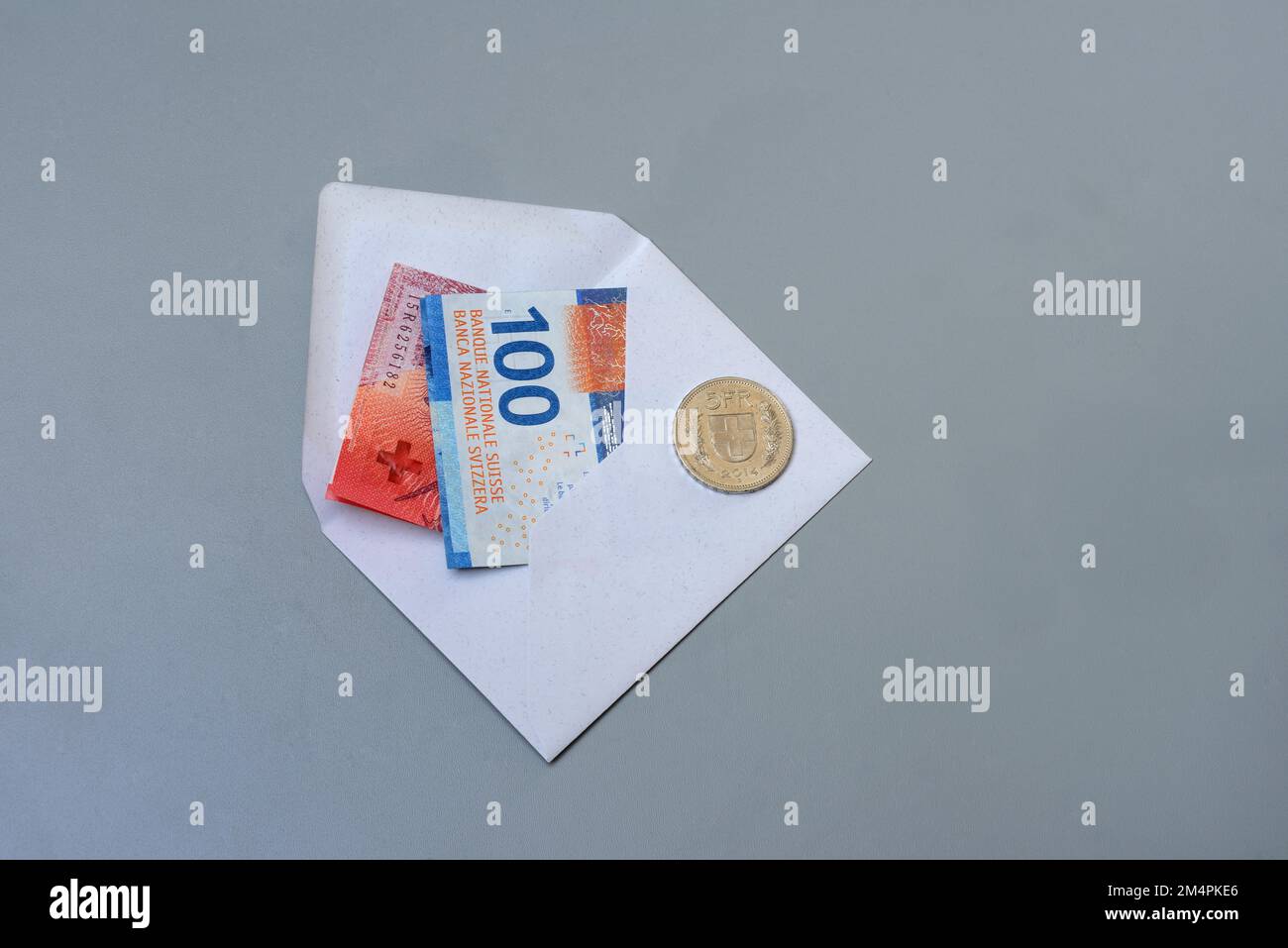Swiss banknotes with envelope, money gift, symbol photo Stock Photo - Alamy